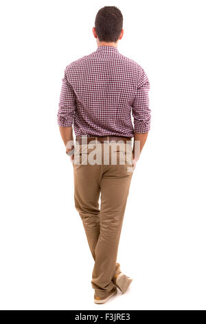 Handsome teen boy with his back turned to camera, pointing to something ...