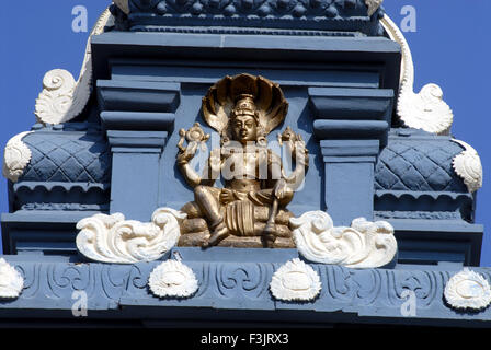 Sculpture of Lord Vishnu sitting on the Sheeshnaga. snake and maids ...