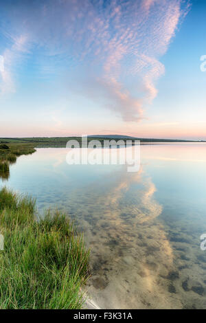 Sunset reflections over the water Stock Photo - Alamy