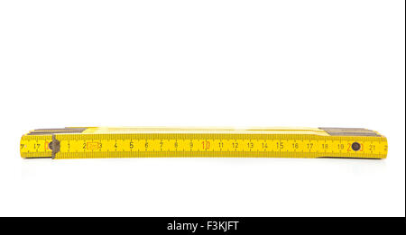 Standard folding meter stick. All on white background Stock Photo - Alamy