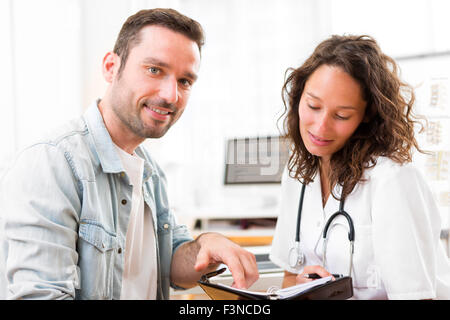 View of a Young attractive doctor dating next appointment Stock Photo ...