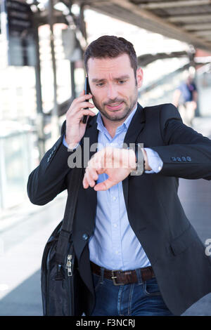 View of a Young attractive man being late to an appointment Stock Photo ...