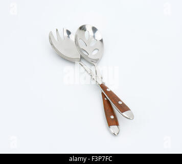 Wooden salad servers set with spoon and fork isolated on white ...