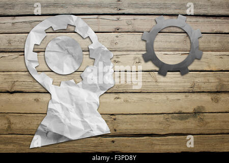 Paper humans head with wheel symbols Stock Photo - Alamy