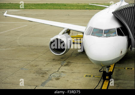 Jetway connected to the airplane for boarding passengers. Boarding ...