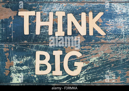 Think big is written on the wooden surface. Wooden Concept Stock Photo ...