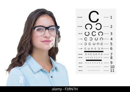 Composite image of pretty geeky hipster smiling at camera Stock Photo ...