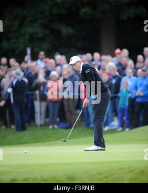 Matthew Fitzpatrick, of England, watches his putt on the fifth hole ...