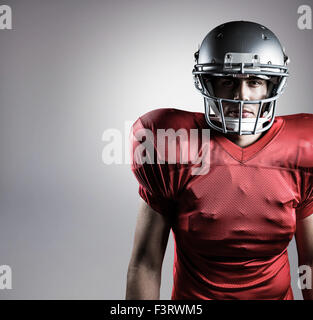 Composite image of portrait of determined american football player in ...