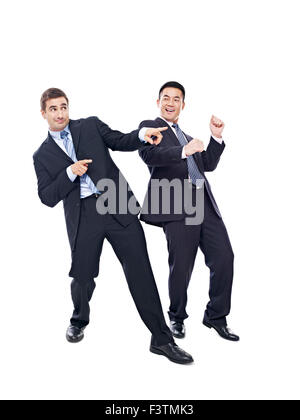 Happy and cheerful Asian businessman dancing near the office rejoices ...