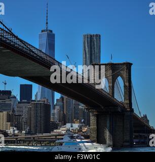 The Brooklyn Bridge with the One World Trade Center and skyscrapers in ...