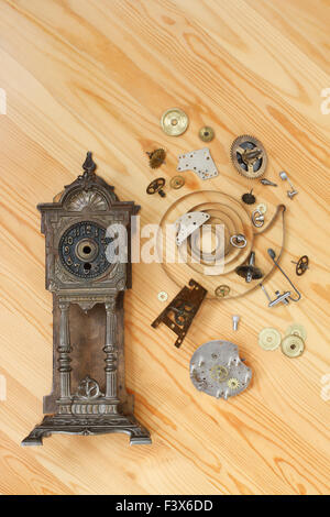 Pile of the old parts of mechanical clocks on a wooden background Stock ...