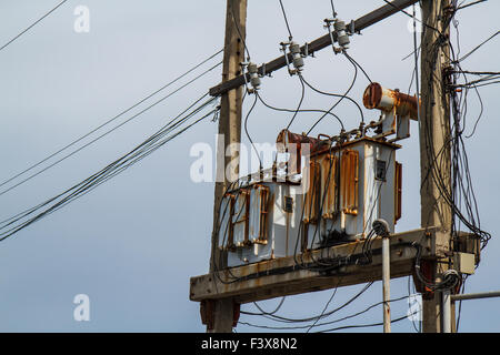 old three-phase transformer with electric pole Stock Photo - Alamy