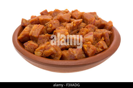 Pepperoni pizza topping that has been chopped into small cubes isolated ...