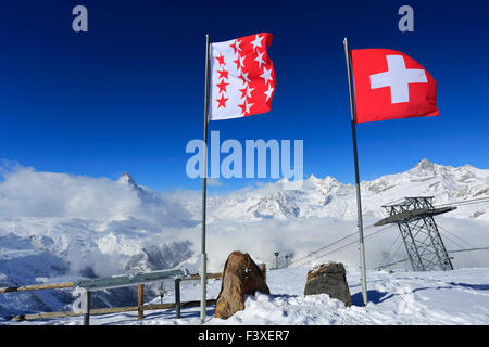 Flag of the Canton du Valais, and the Swiss national flag, Swiss Alps ...