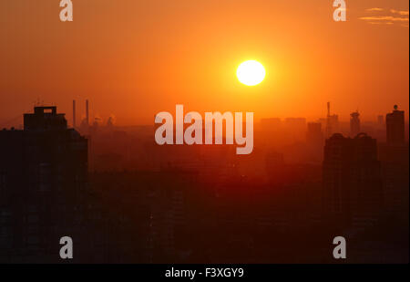 Vivid sunrise over the city buildings in morning Stock Photo - Alamy