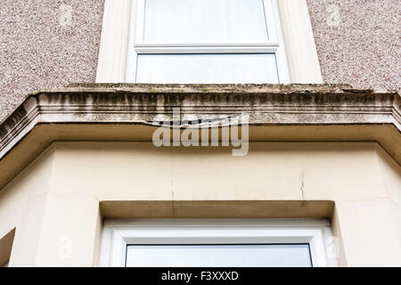 Water damage above bay window on private English house, showing the ...
