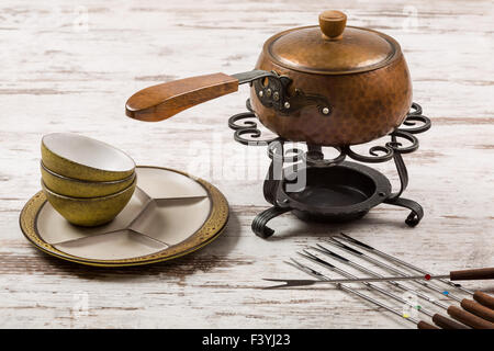 New Year's Eve party, fondue, couples, young, happily, table, sit, tear ...