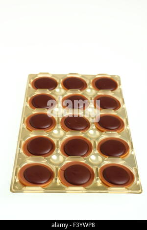 Box of Toffifee hazelnut and caramel candy cups topped with chocolate ...