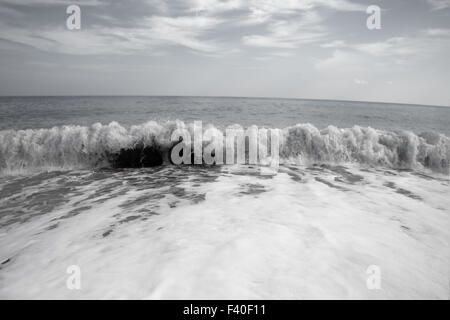 Strange sea effect in wave ocean beach Stock Photo - Alamy