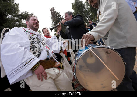 Gypsy musicians play the zurna and daouli while vlachs dance around a ...