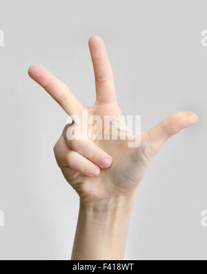 hand with three fingers raised on yellow background. symbol meaning in ...
