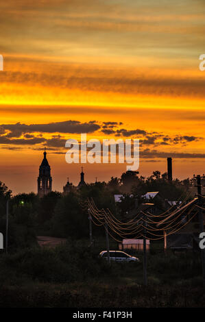 Sunset over small town in Dolomites, Italy Stock Photo - Alamy