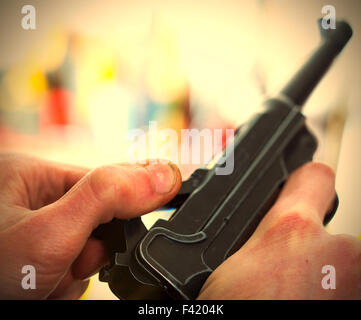 Luger automatic pistol in a human hand Stock Photo - Alamy