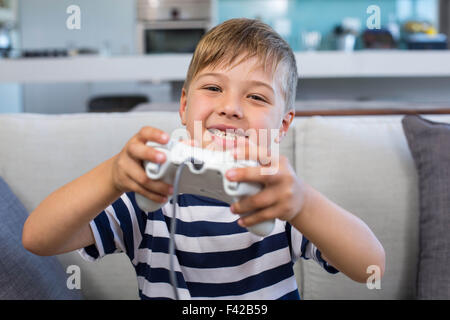 Little boy playing video games Stock Photo - Alamy