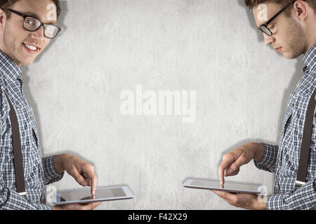 Composite image of nerd with tablet pc Stock Photo - Alamy