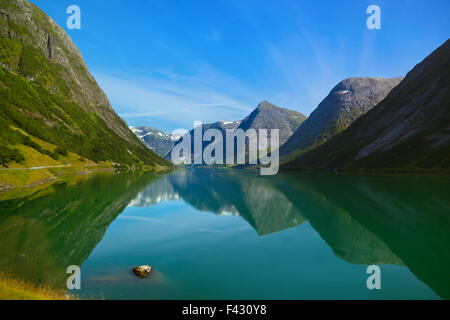 Reflection in Norway fjord at fall time Stock Photo - Alamy