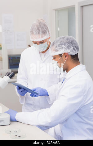 Scientists using tablet pc Stock Photo - Alamy