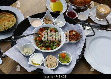 Traditional Israeli Breakfast with omelet, cheeses, salads, a fresh ...