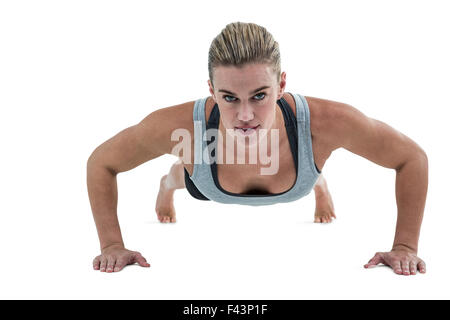 Muscular woman doing push ups Stock Photo - Alamy