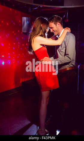 Cute couple slow dancing together at the nightclub Stock Photo - Alamy