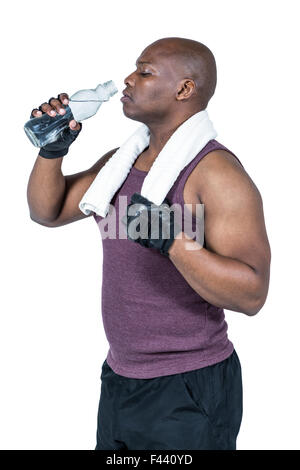 Handsome and fit young man exercising with dumbbells isolated in white ...