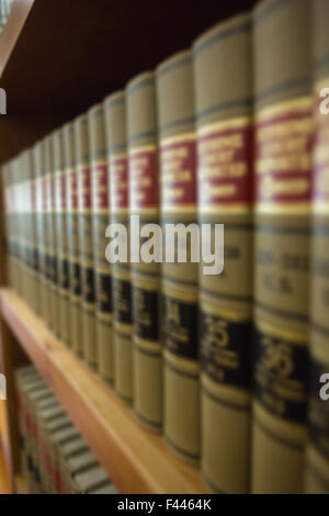 Volumes of books on bookshelf in library Stock Photo - Alamy