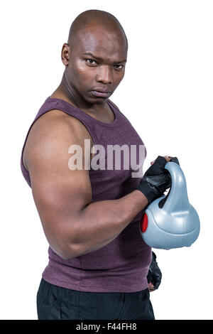 Fit man working out with kettlebell Stock Photo - Alamy
