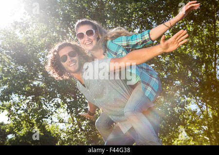 Cute couple having fun in park Stock Photo - Alamy