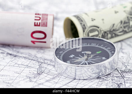 Compass and Money Stock Photo - Alamy