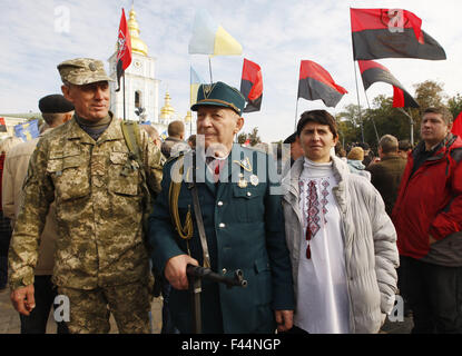 Kiev, Ukraine. 14th Oct, 2015. The boy gives flowers to the veteran UPA ...