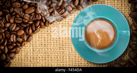 Composite image of blue cup of coffee Stock Photo - Alamy