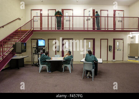 Multi-ethnic criminals in prison uniforms Stock Photo - Alamy