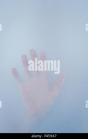 Hand touching frosted glass Stock Photo - Alamy