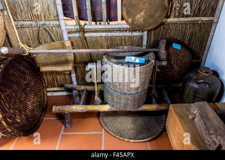 Ancient Vietnamese farming and fishing tools on display Stock Photo - Alamy