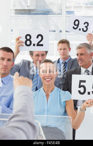 Business team giving mark after conference Stock Photo - Alamy