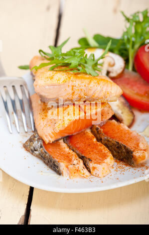 grilled fresh samon filet with vegetables salad tomato arugula ...