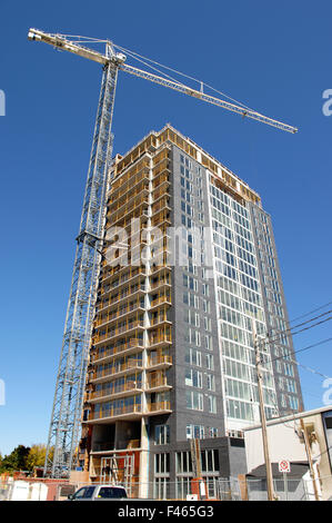 Unfinished high-rise building with concrete walls and scaffolding ...