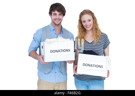 Young volunteer man holding your donation matters banner pointing ...