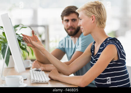 Creative business people using computer Stock Photo - Alamy